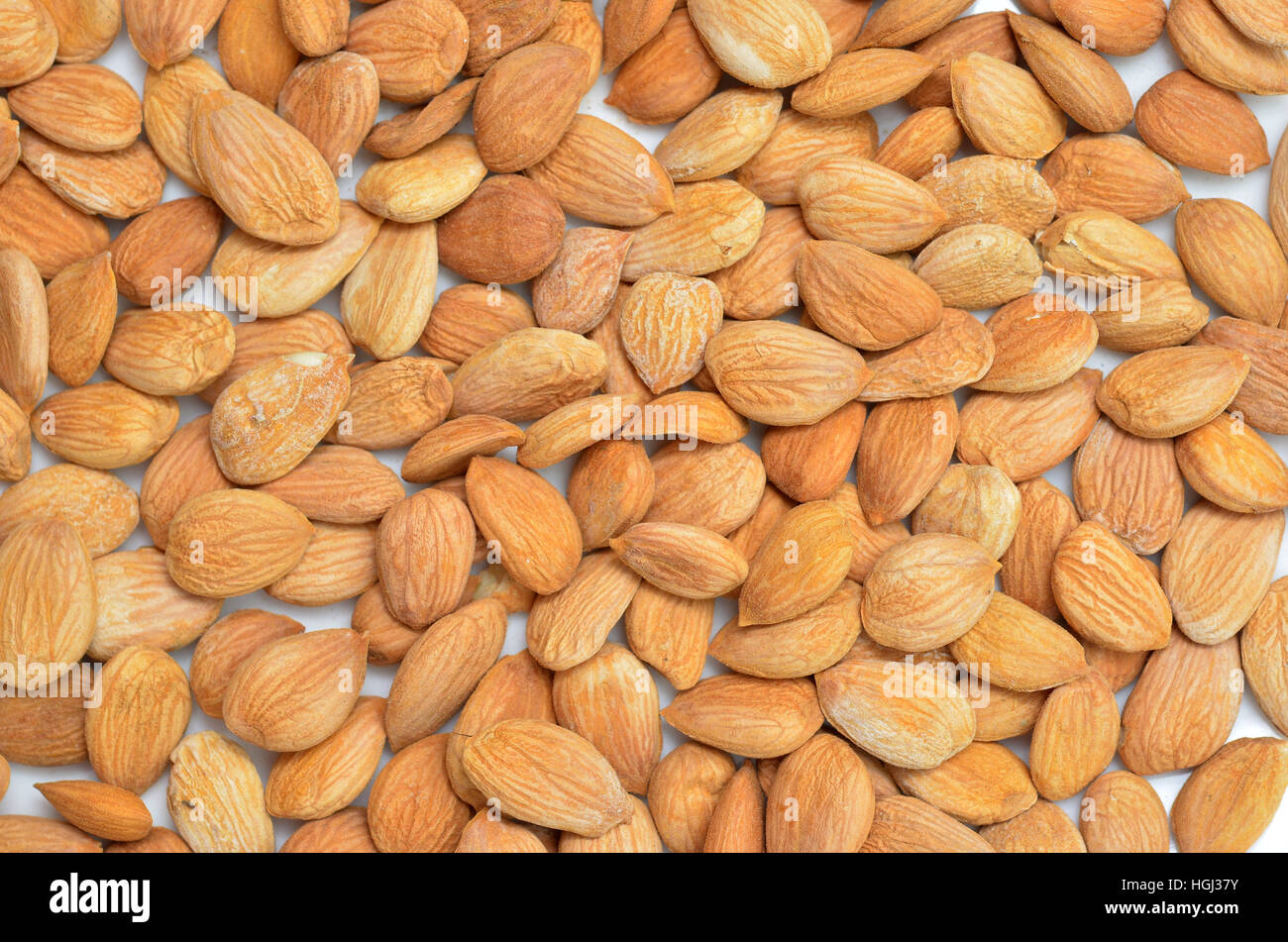 Almonds close-up background Stock Photo - Alamy