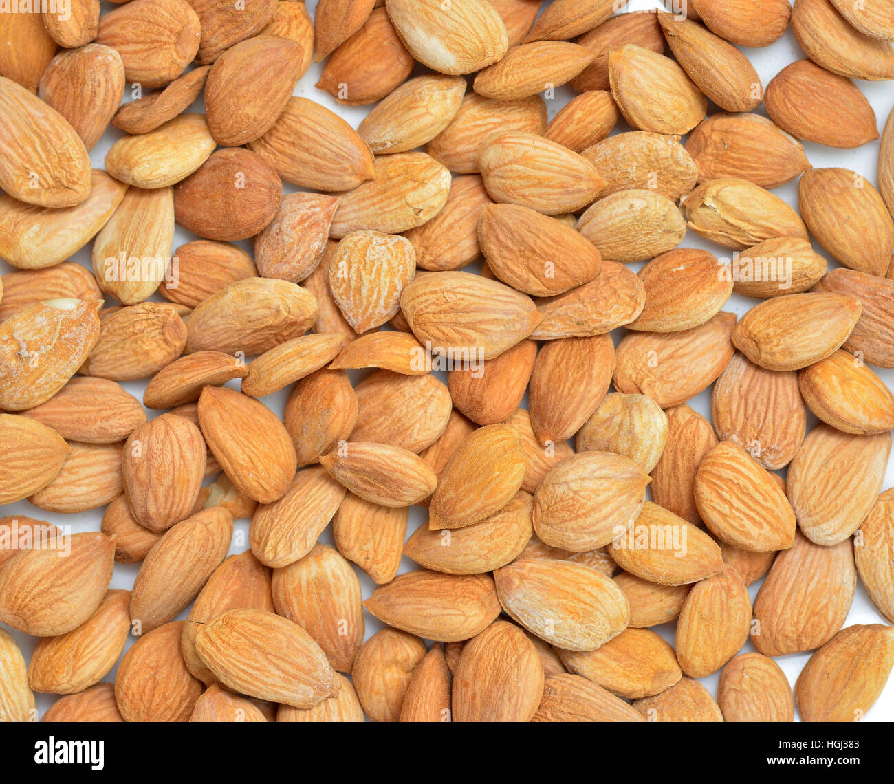 Almonds close-up background Stock Photo - Alamy