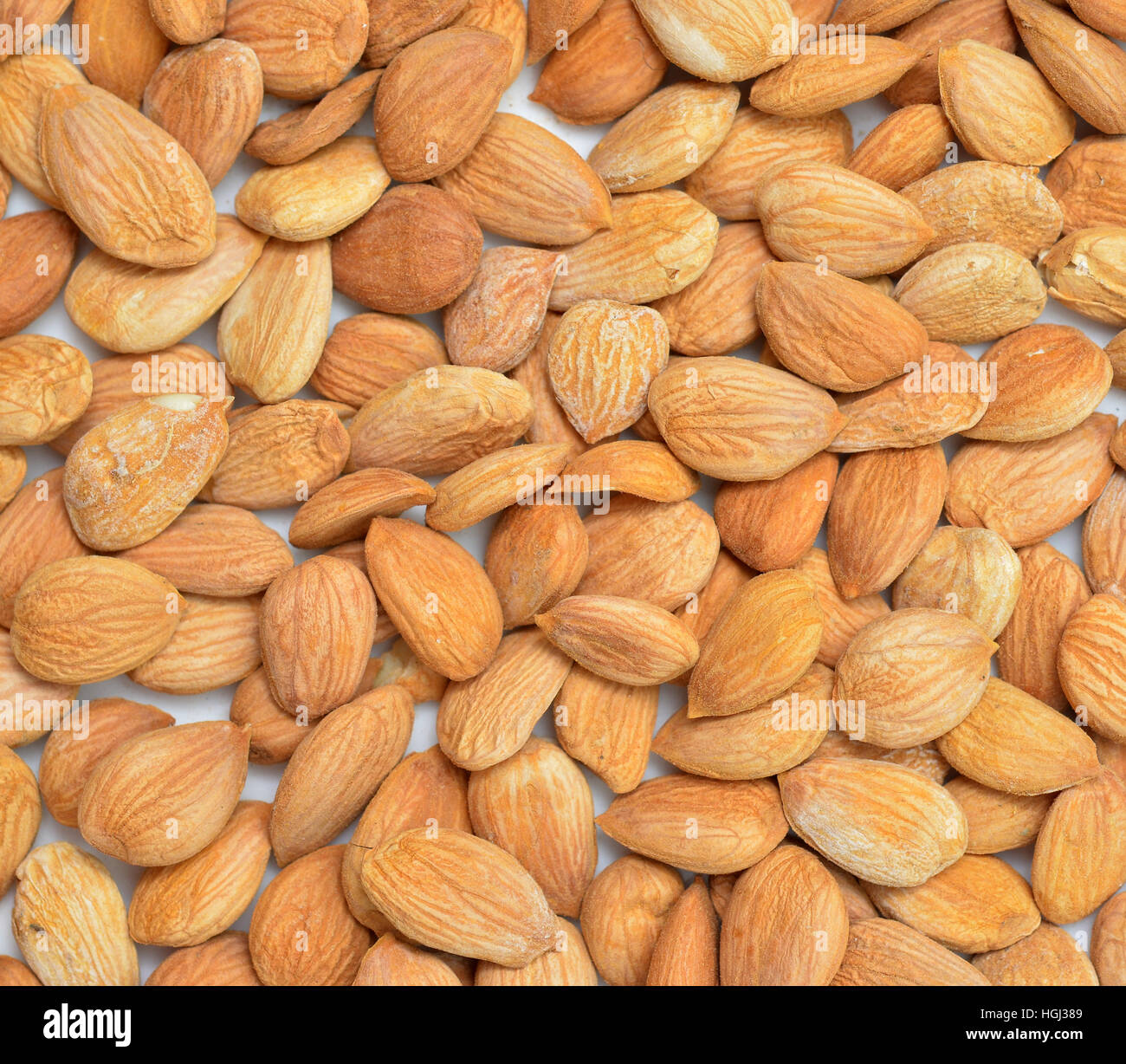 Almonds close-up background Stock Photo - Alamy