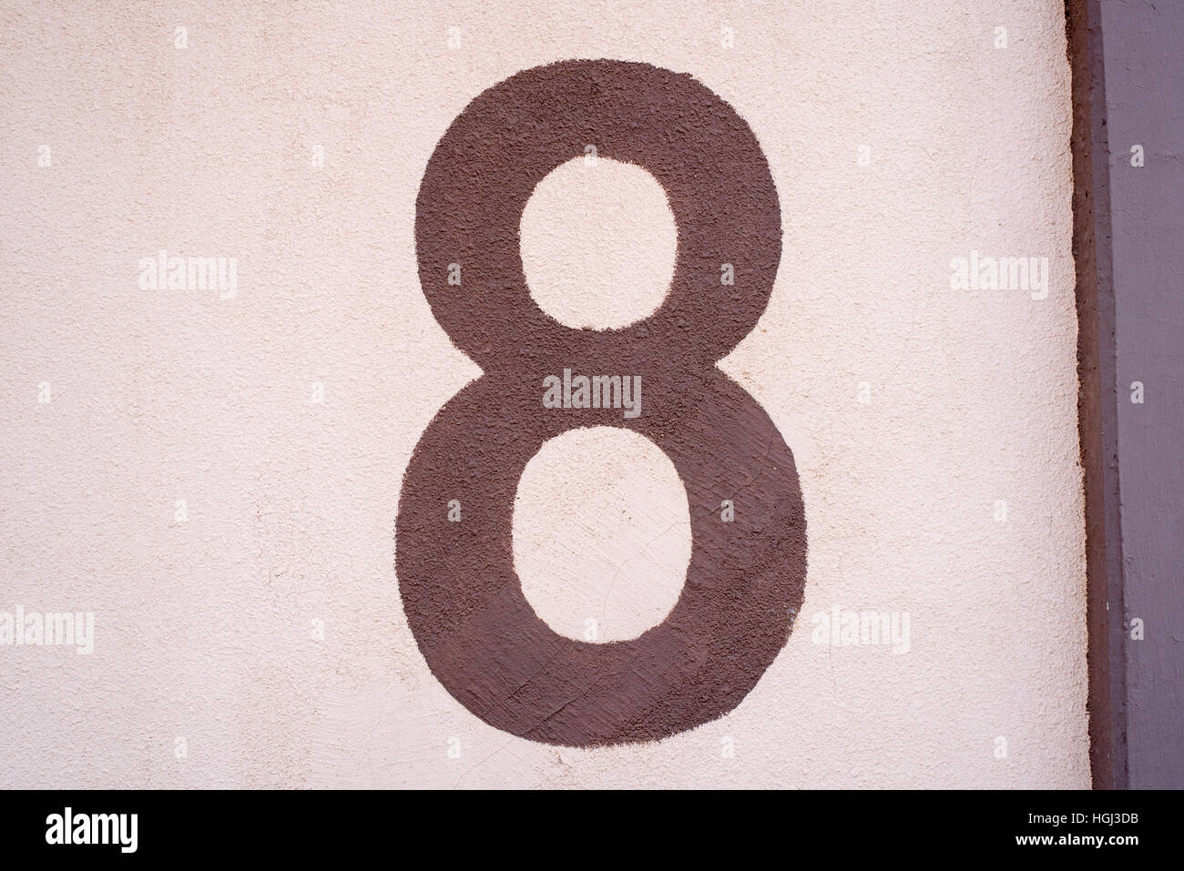 Number eight painted on wall Stock Photo - Alamy
