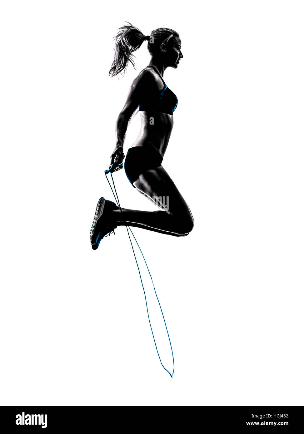 one caucasian woman Jumping Rope exercises in studio silhouette ...