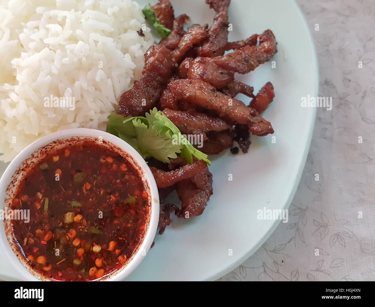 Thailand food style:"Kaow Moo Tod Nam Jim Jaw"Fried pork with rice ...