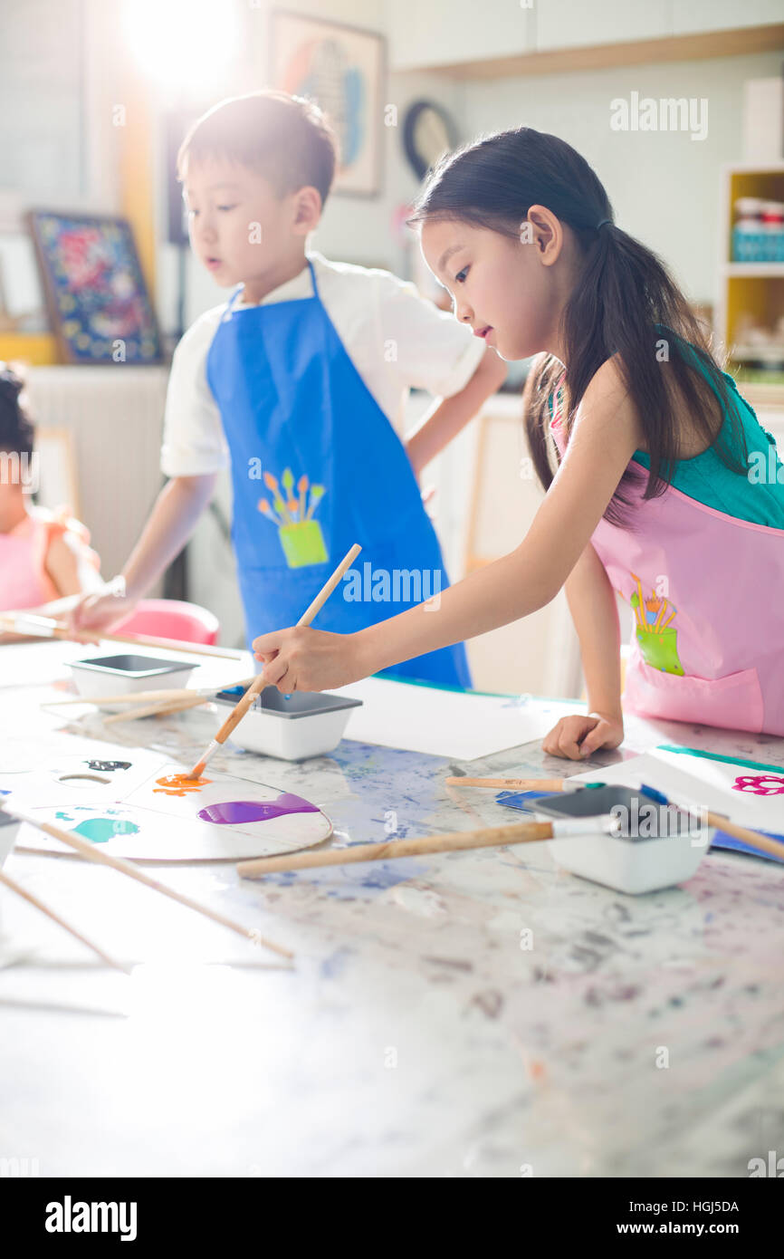 Little children painting in art class Stock Photo - Alamy