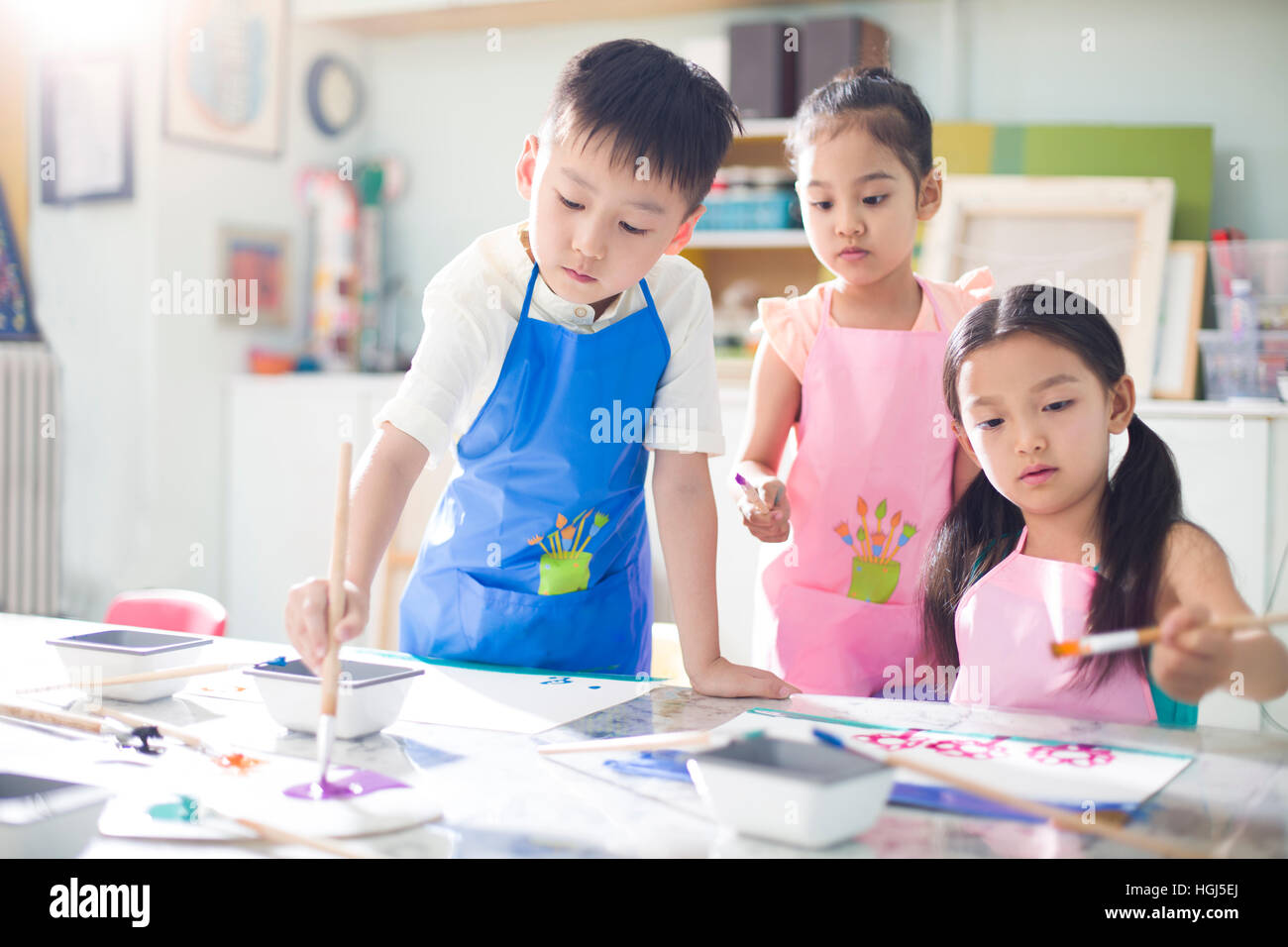 Little children painting in art class Stock Photo - Alamy