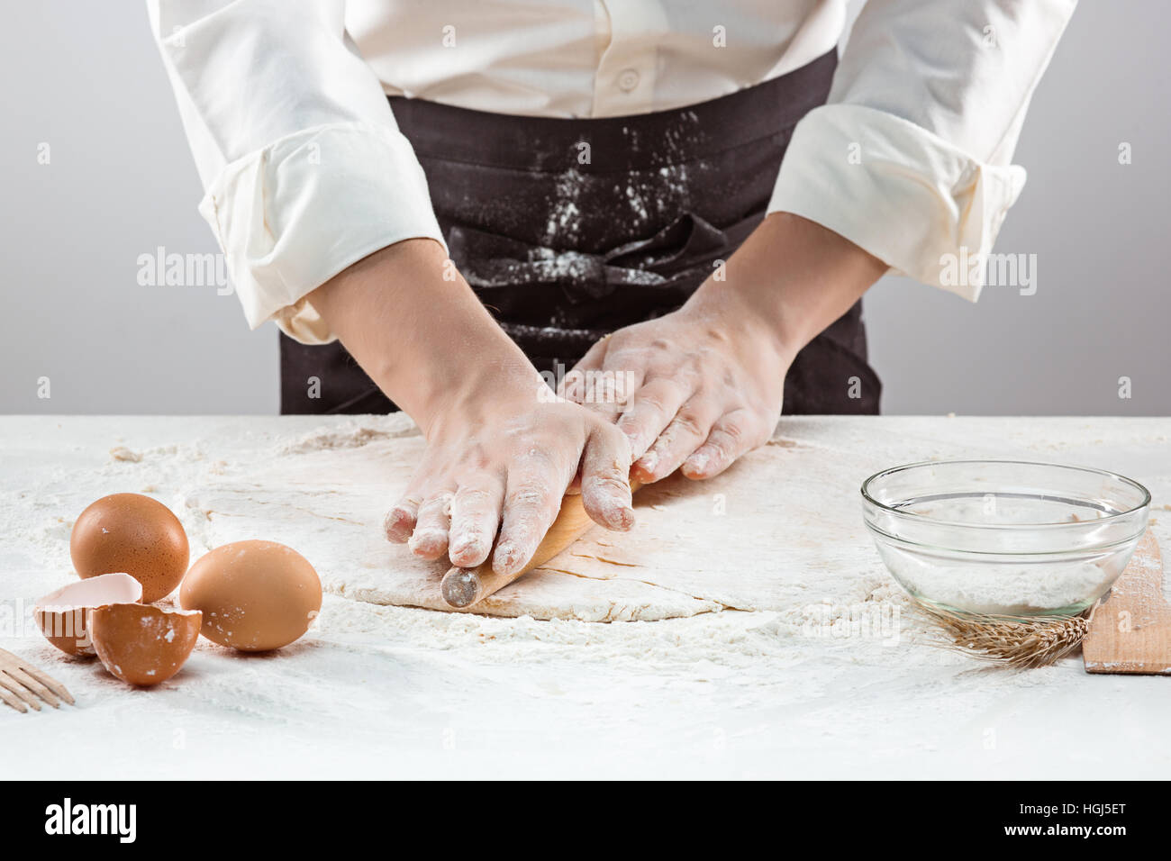 Hands kneading a dough Stock Photo - Alamy