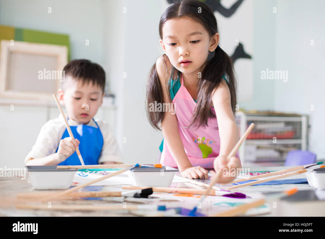 Little children painting in art class Stock Photo - Alamy