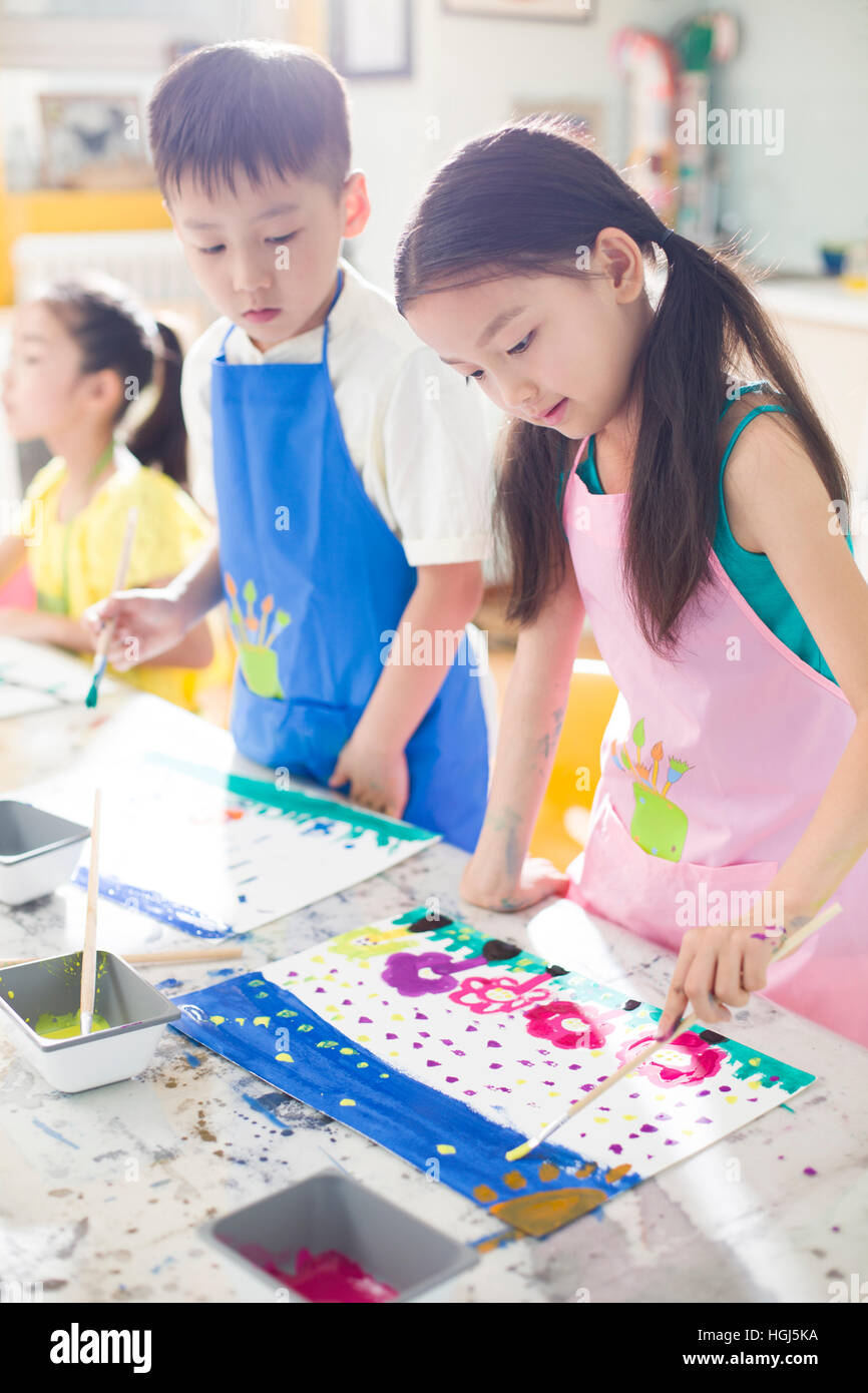 Little children painting in art class Stock Photo - Alamy