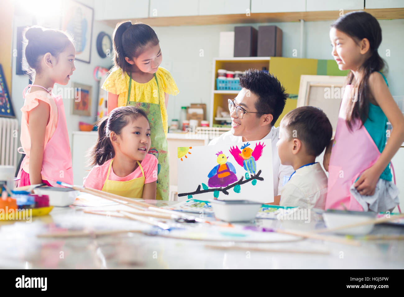 Little children in art class with teacher Stock Photo - Alamy