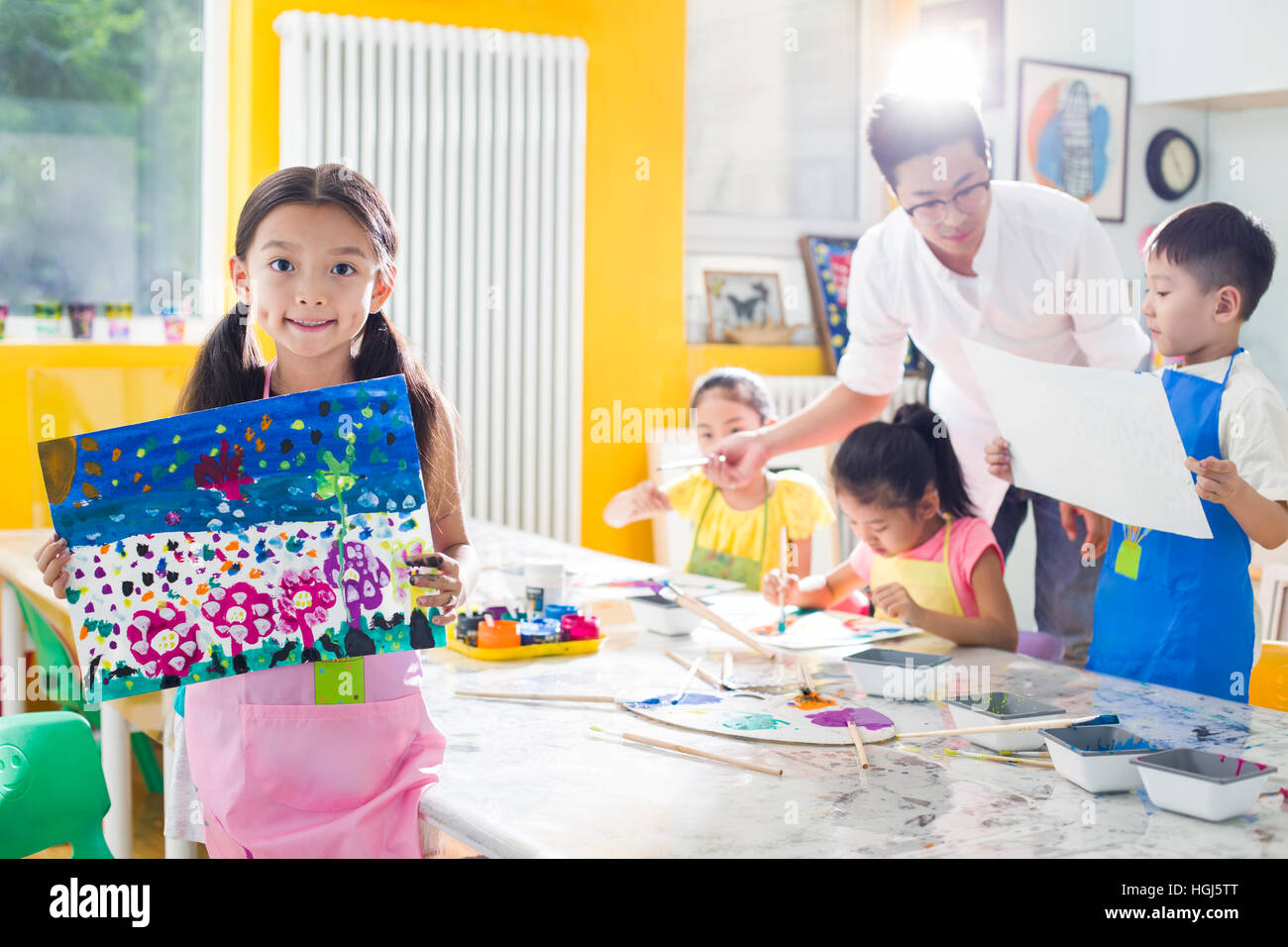 Little children in art class with teacher Stock Photo - Alamy