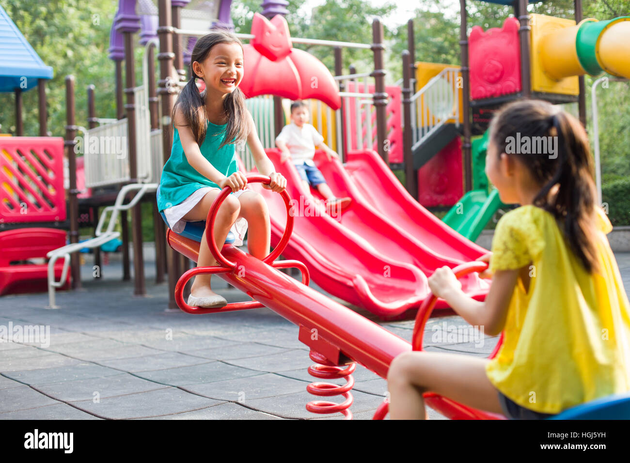 Happy children playing in park Stock Photo - Alamy