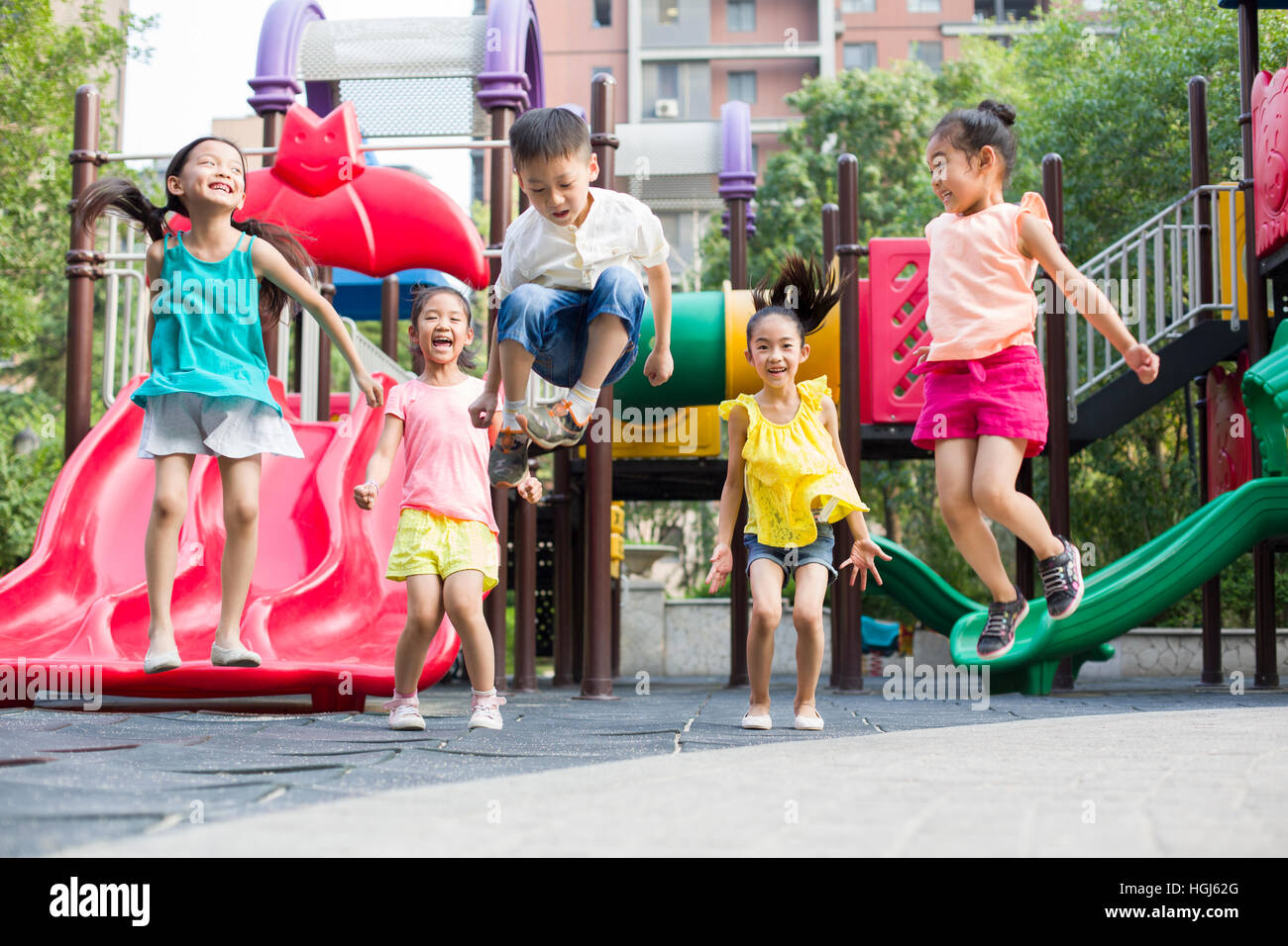 Happy children playing in park Stock Photo - Alamy