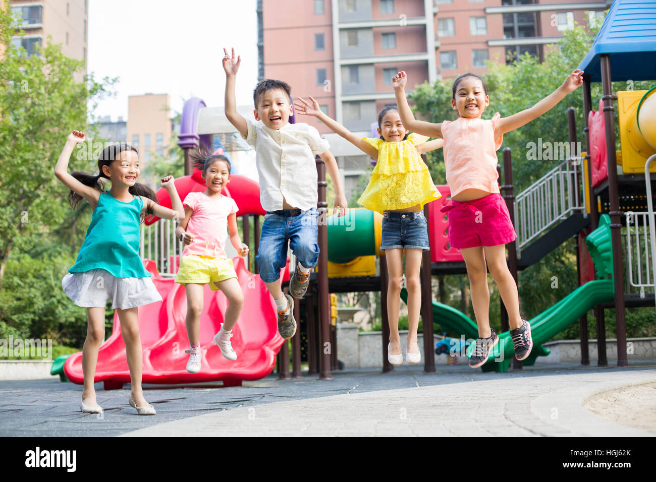 Happy children playing in park Stock Photo - Alamy