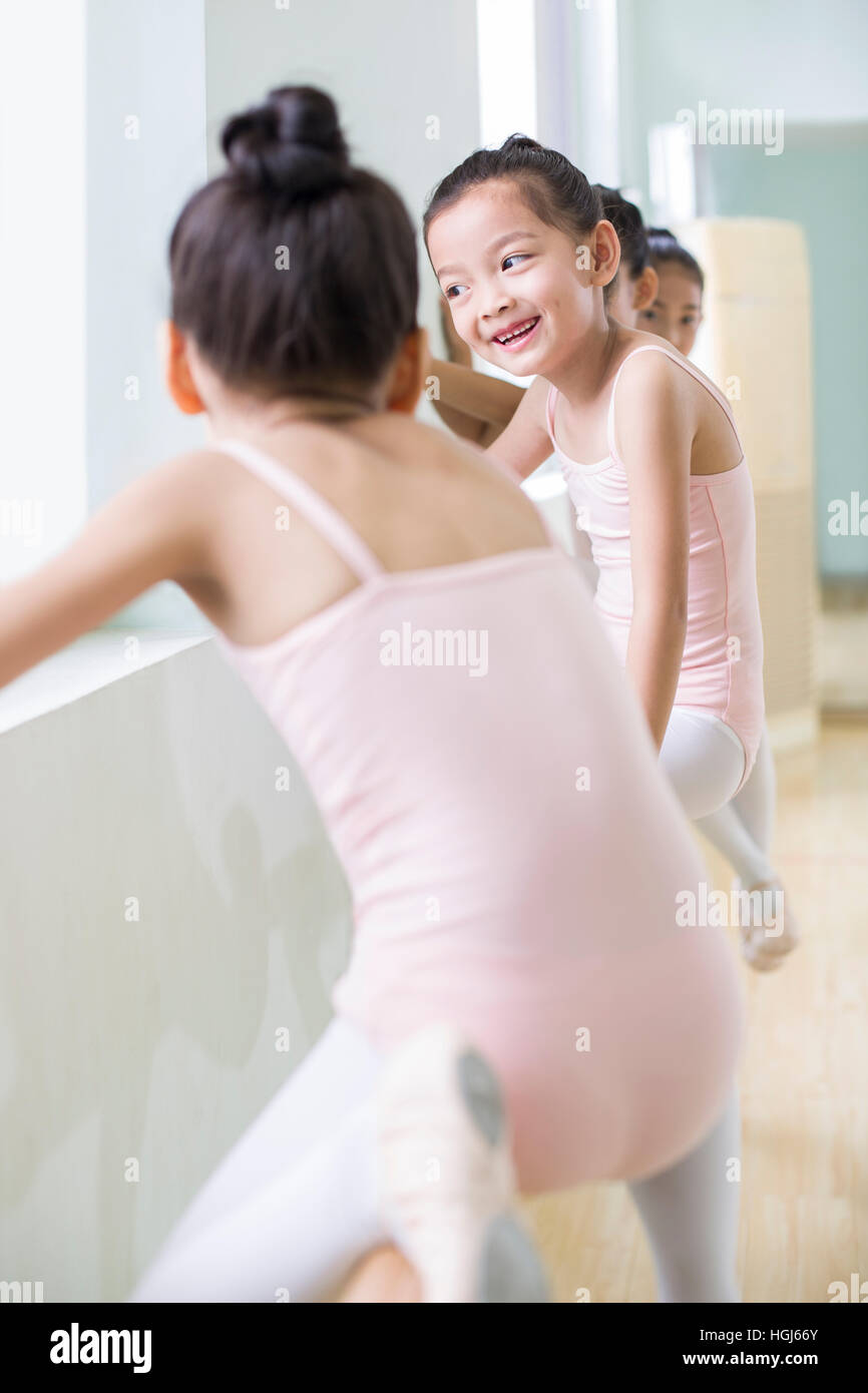 Little ballet dancers resting in dance studio Stock Photo - Alamy