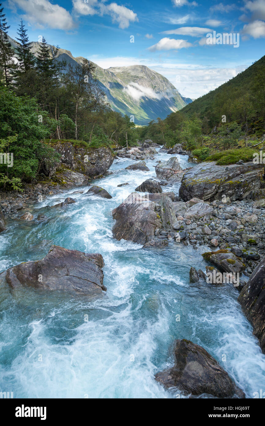 Norwegian landscape with milky blue glacier river near Trollstigen ...