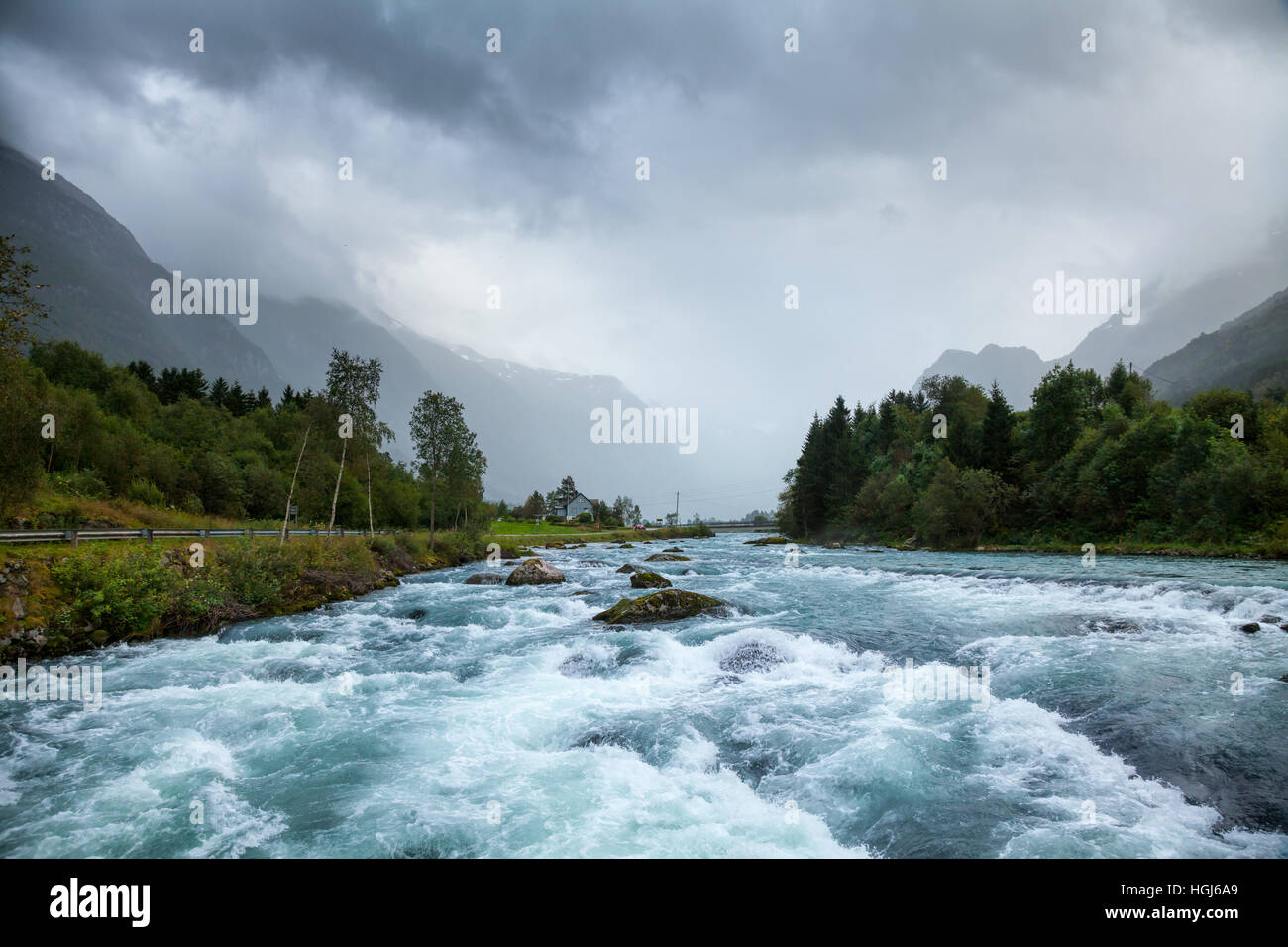 Norwegian landscape with milky blue glacier river Oldeelva in Oldedalen ...