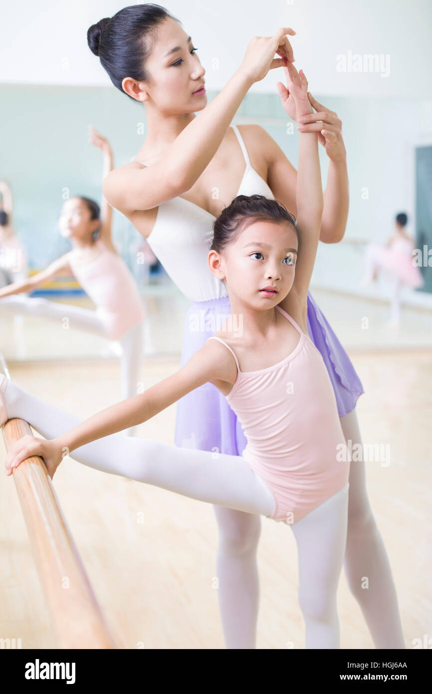 Young ballet instructor teaching girl in ballet studio Stock Photo - Alamy