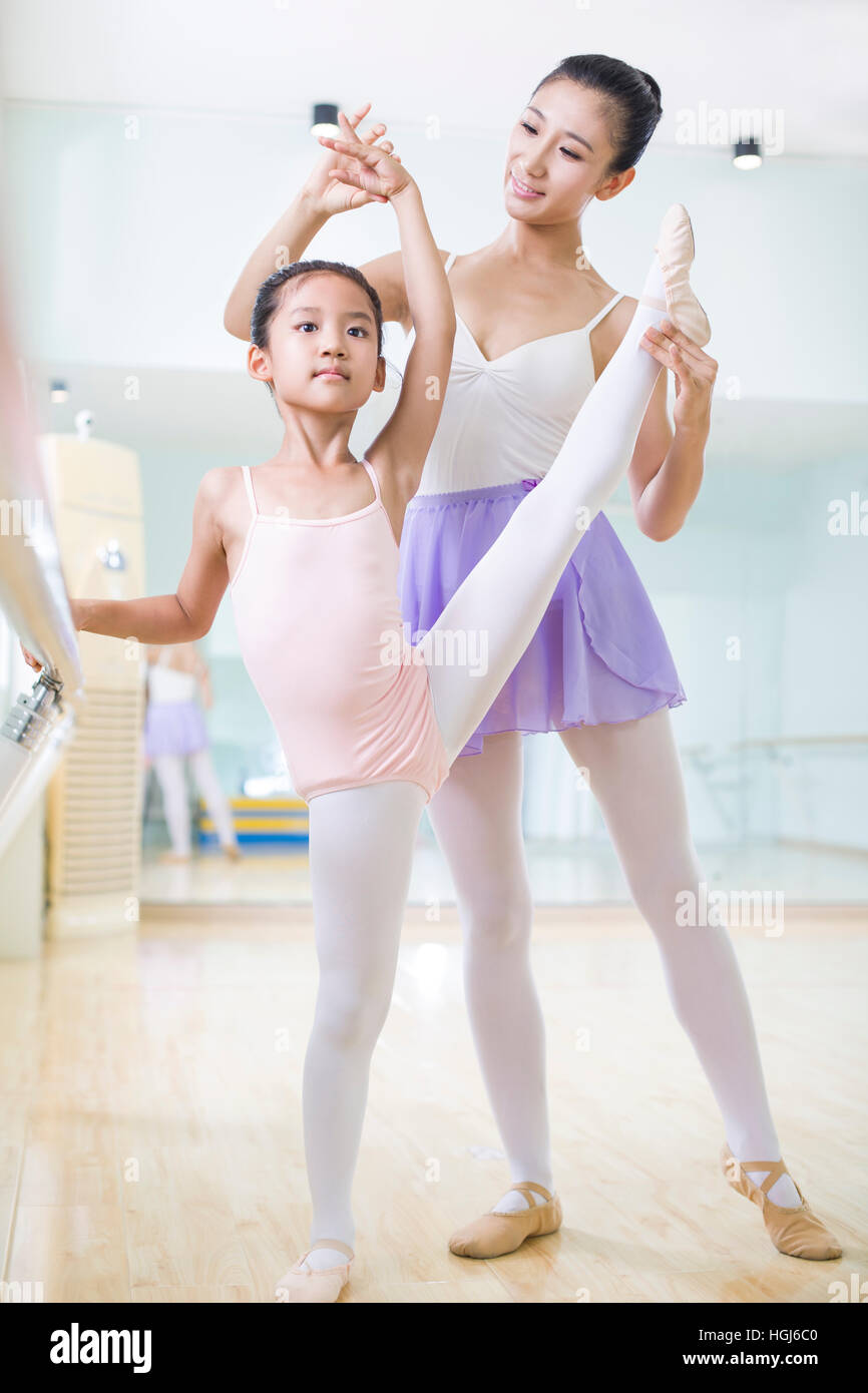 Young ballet instructor teaching girl in ballet studio Stock Photo - Alamy