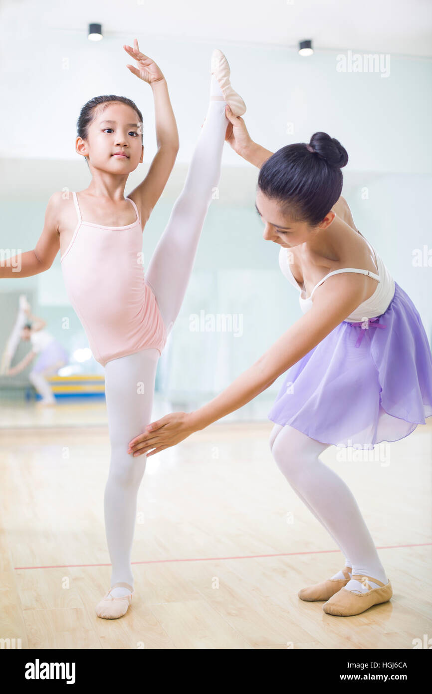 Young ballet instructor teaching girl in ballet studio Stock Photo - Alamy