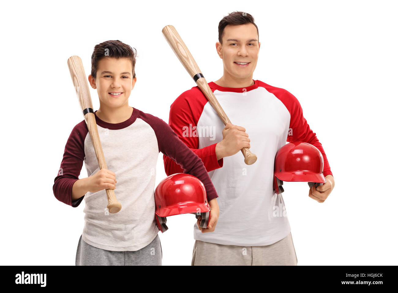 Little boy and a young man with baseball bats and helmets isolated on ...
