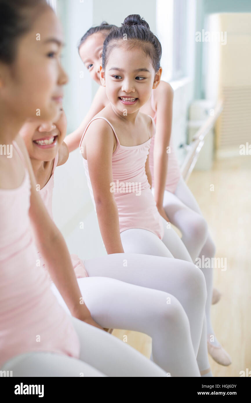Little ballet dancers resting in dance studio Stock Photo - Alamy