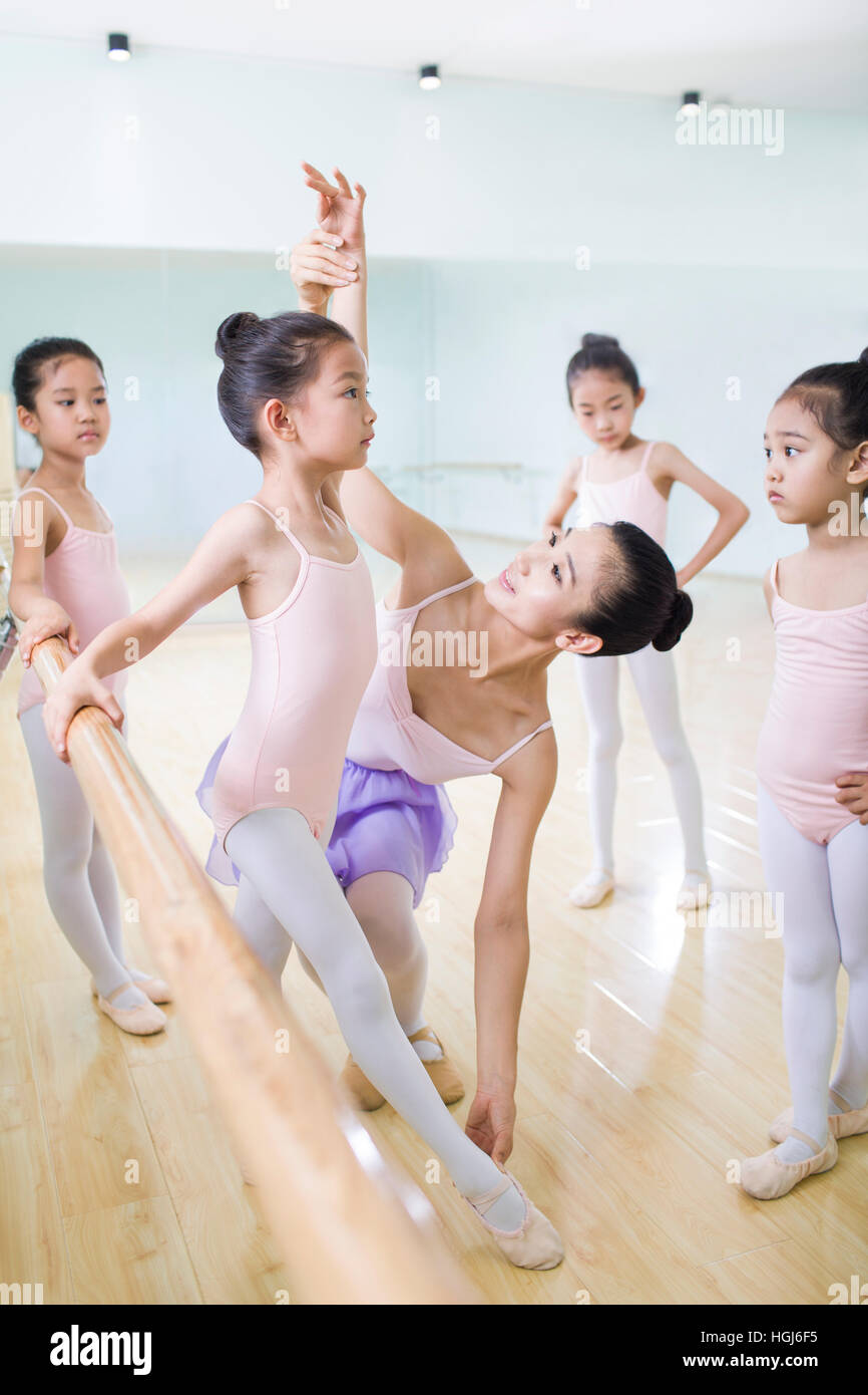 Young ballet instructor teaching girls in ballet studio Stock Photo - Alamy