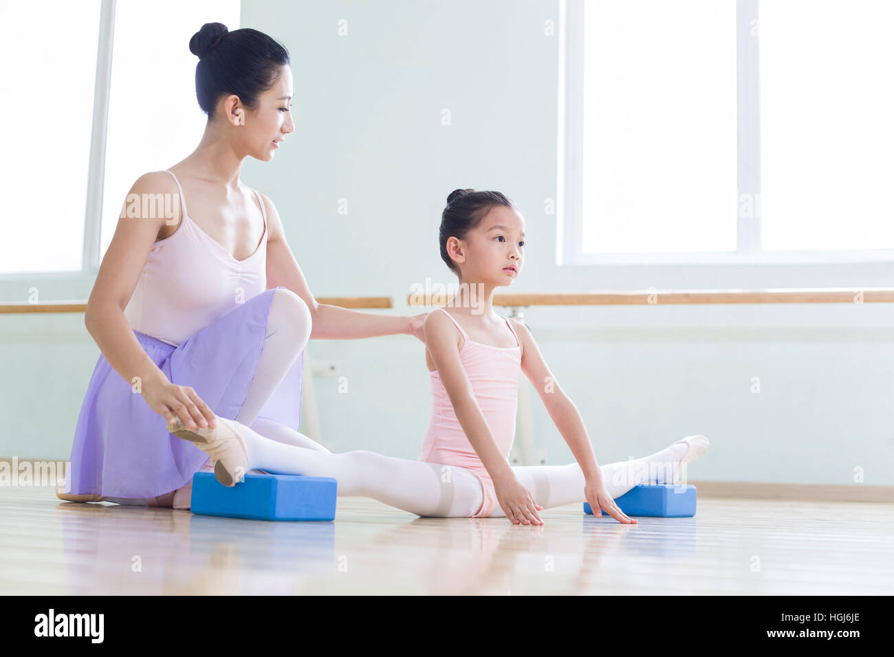 Young ballet instructor teaching girl in ballet studio Stock Photo - Alamy