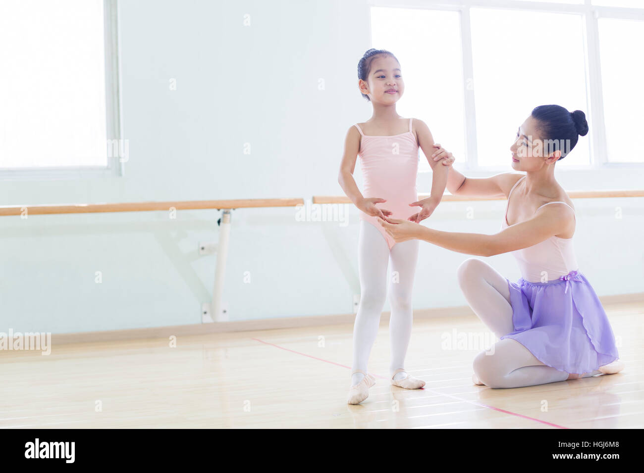 Young ballet instructor teaching girl in ballet studio Stock Photo - Alamy