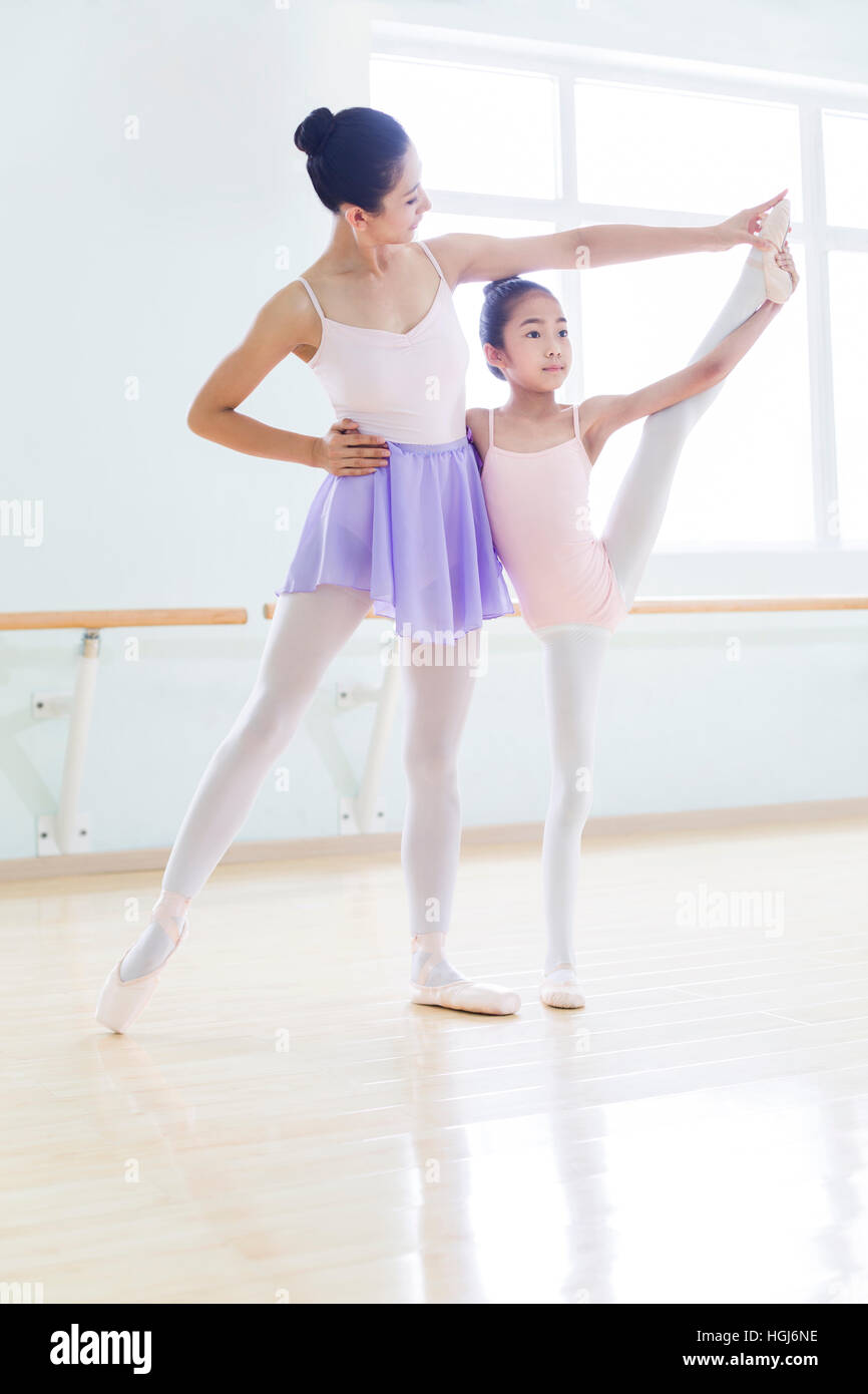 Young ballet instructor teaching girl in ballet studio Stock Photo - Alamy