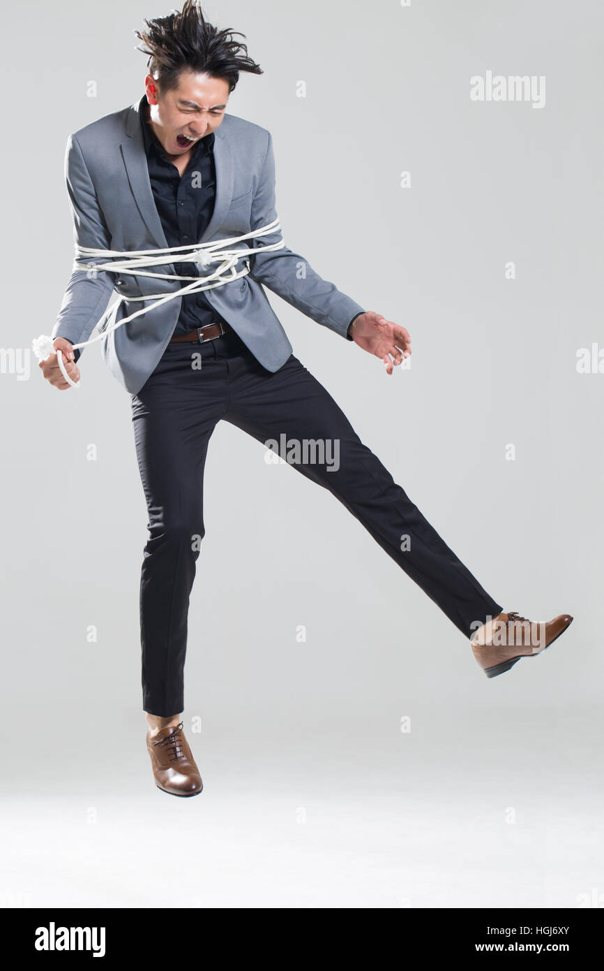 Legs tied rope hi-res stock photography and images - Alamy