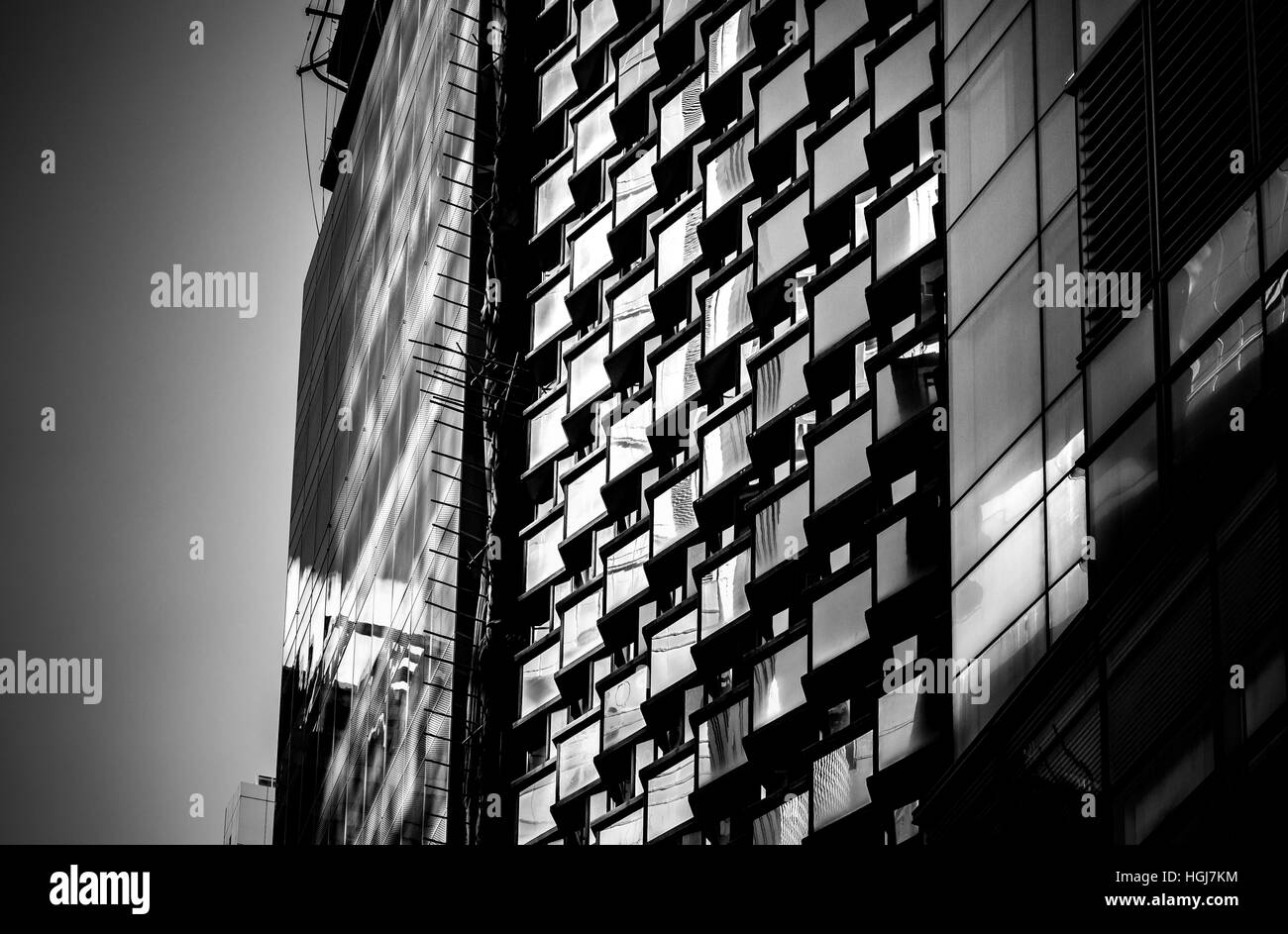 Windows of commercial building in Hong Kong with B&W color Stock Photo ...