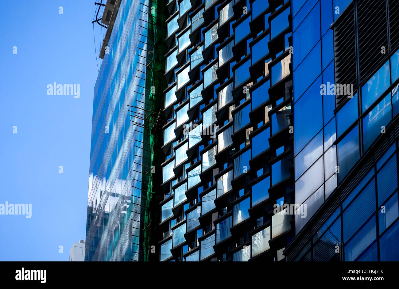 Windows of commercial building in Hong Kong Stock Photo - Alamy
