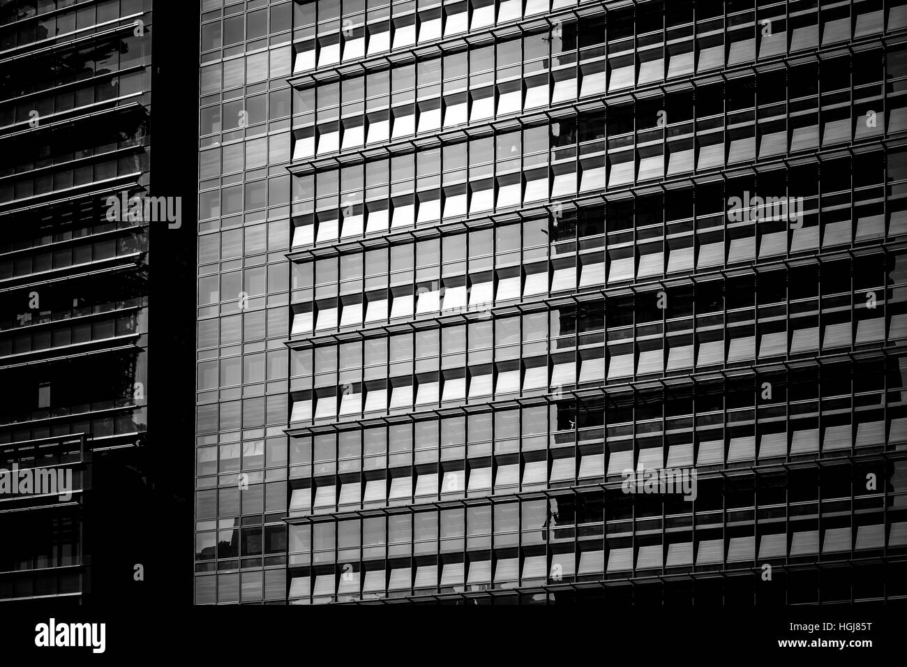 Windows of commercial building in Hong Kong with B&W color Stock Photo ...