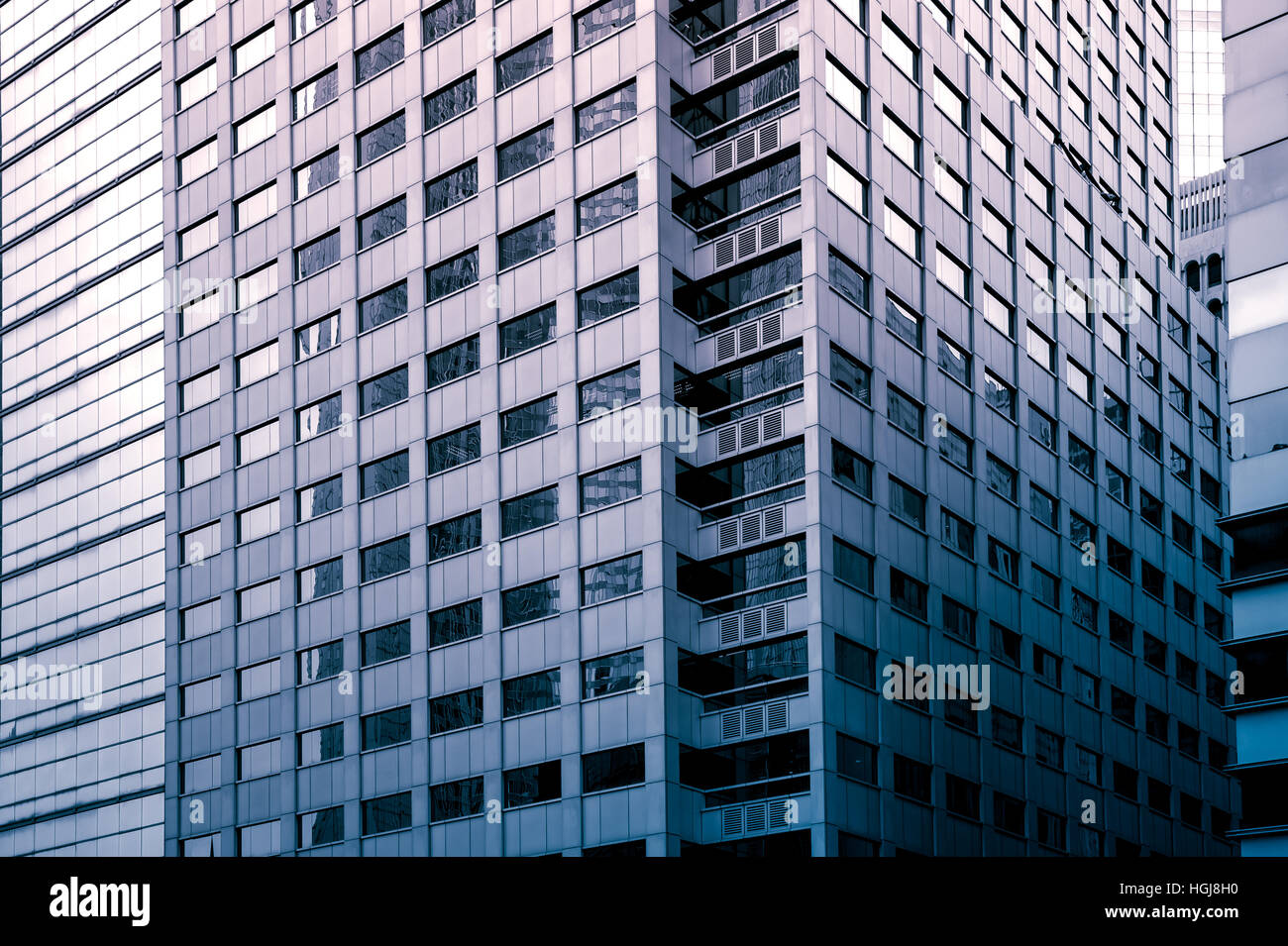 Windows of commercial building in Hong Kong Stock Photo - Alamy