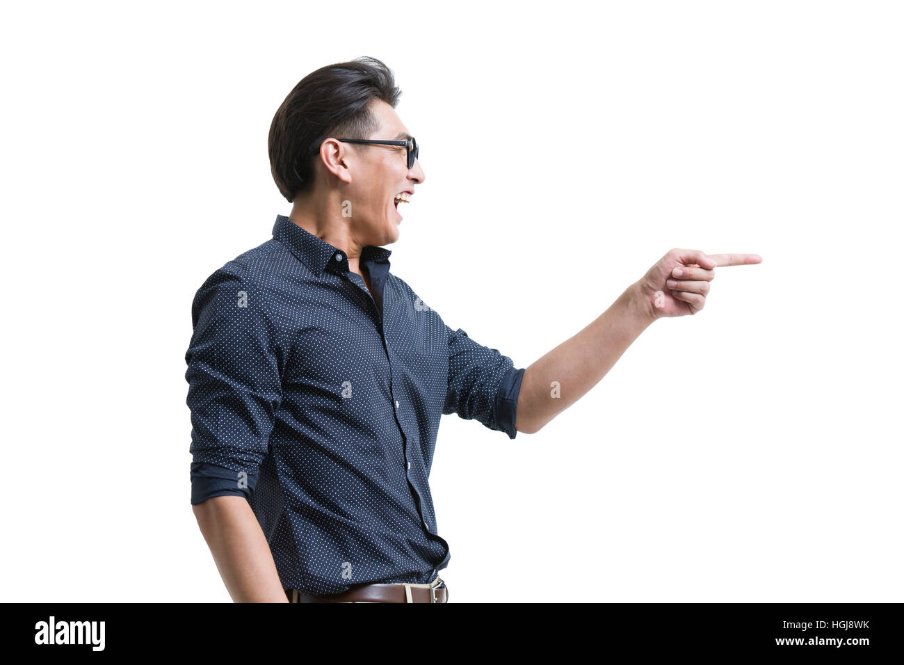 Happy young man pointing Stock Photo - Alamy