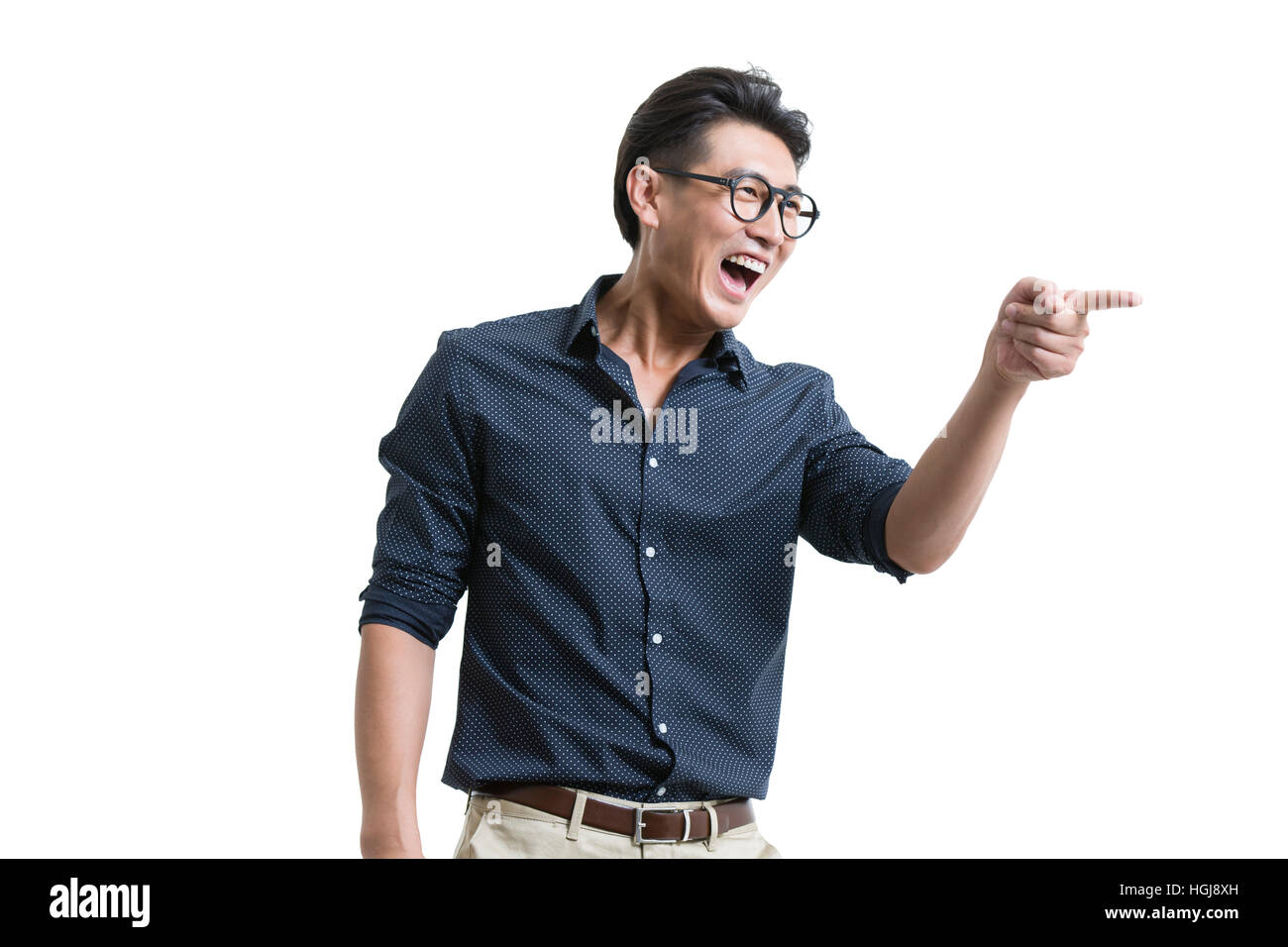 Happy young man pointing Stock Photo - Alamy