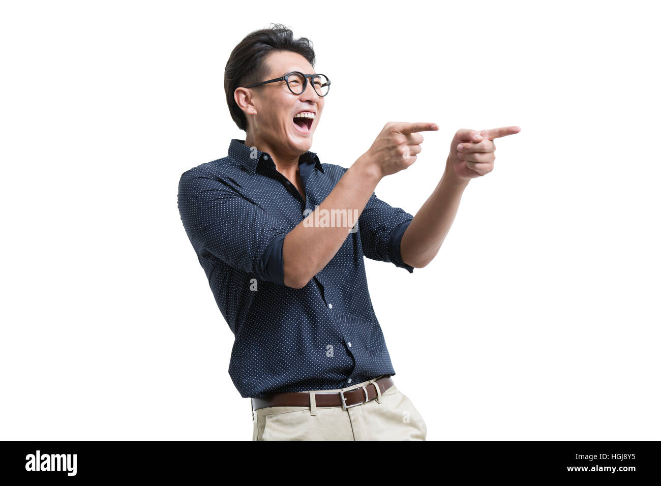 Happy young man pointing Stock Photo - Alamy