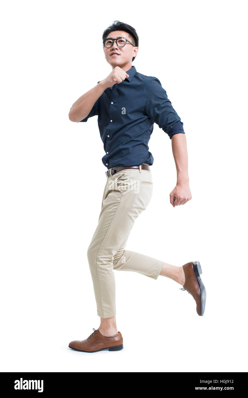 Happy young man running Stock Photo - Alamy