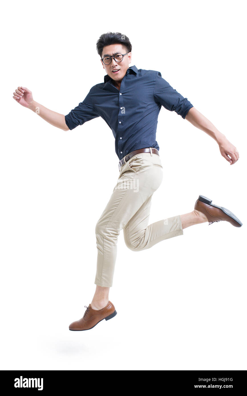 Happy young man jumping Stock Photo - Alamy