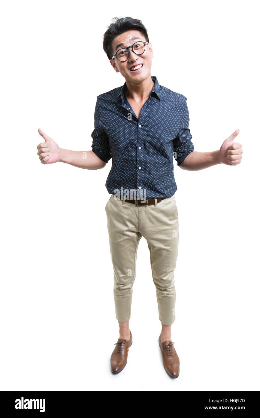 Happy young man doing thumbs up Stock Photo - Alamy