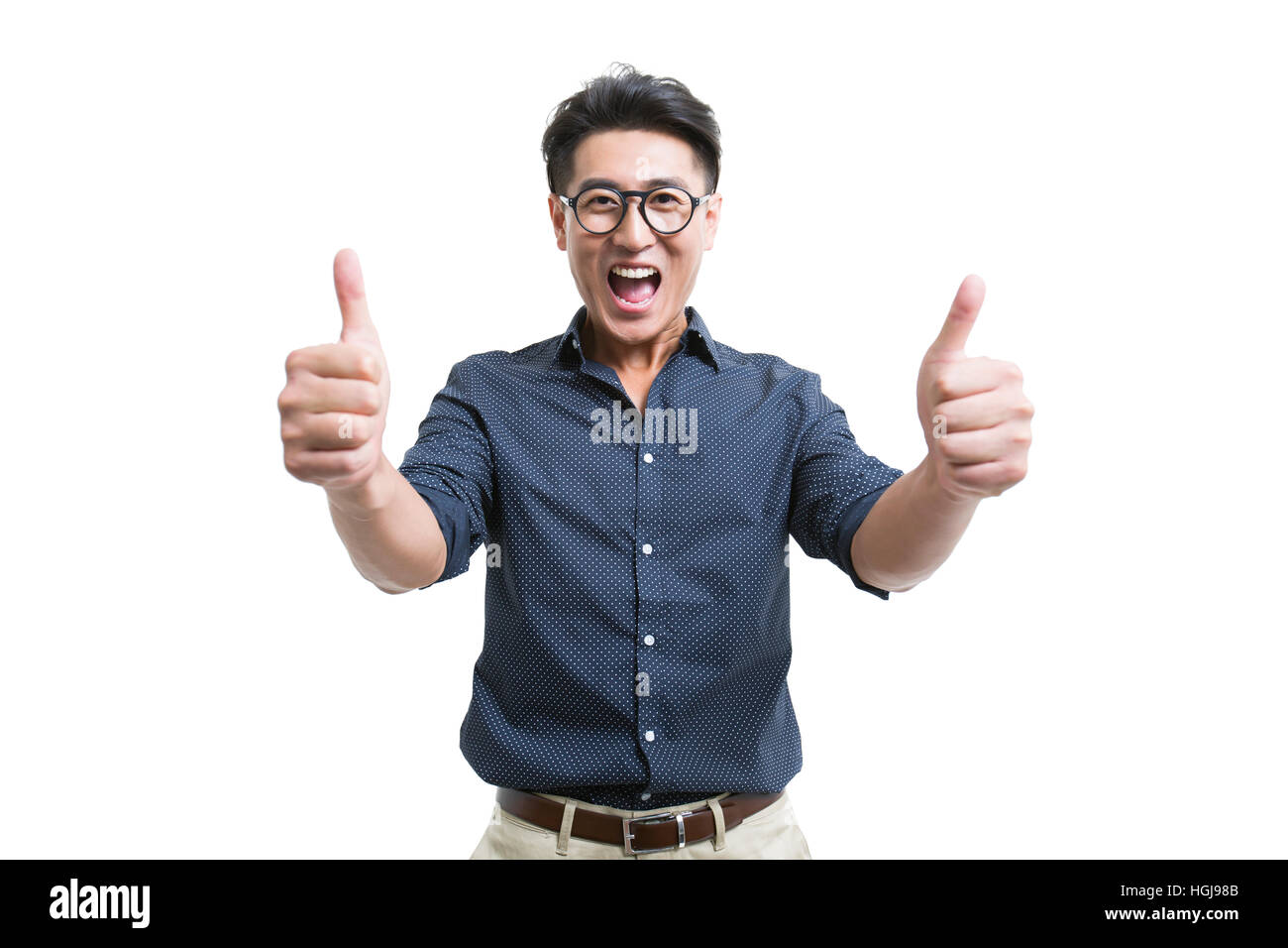 Happy young man doing thumbs up Stock Photo - Alamy