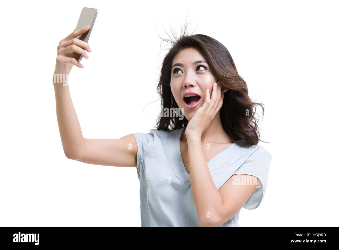 Young woman taking self portrait with smart phone Stock Photo - Alamy