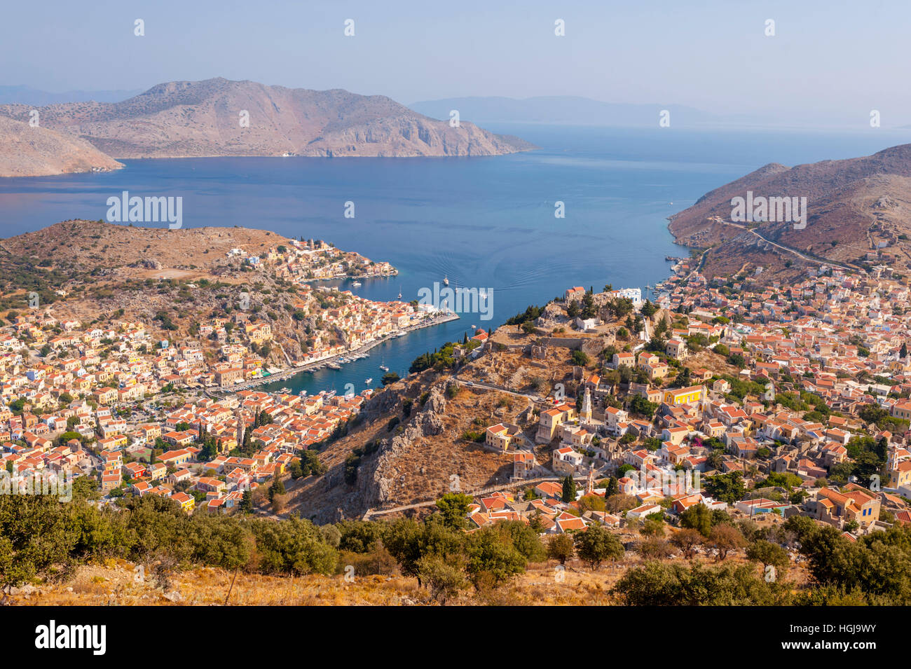 Looking down on the village of Horio and the harbour in Yialos on Symi ...