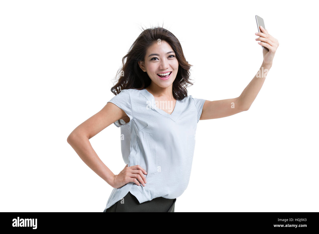 Young woman taking self portrait with smart phone Stock Photo - Alamy
