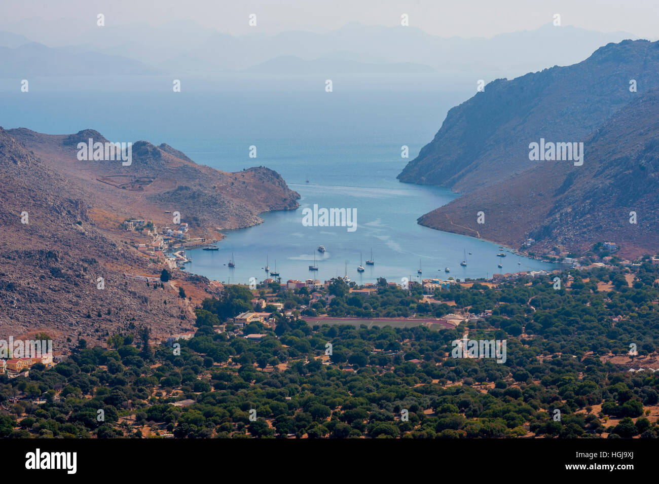 Looking down on the village of Horio and the harbour in Pedi on Symi ...