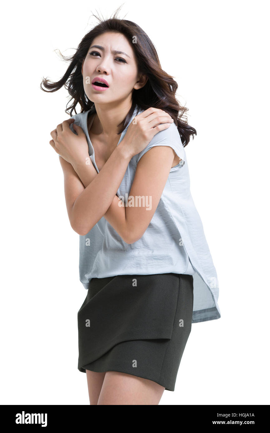 Young woman feeling cold Stock Photo - Alamy