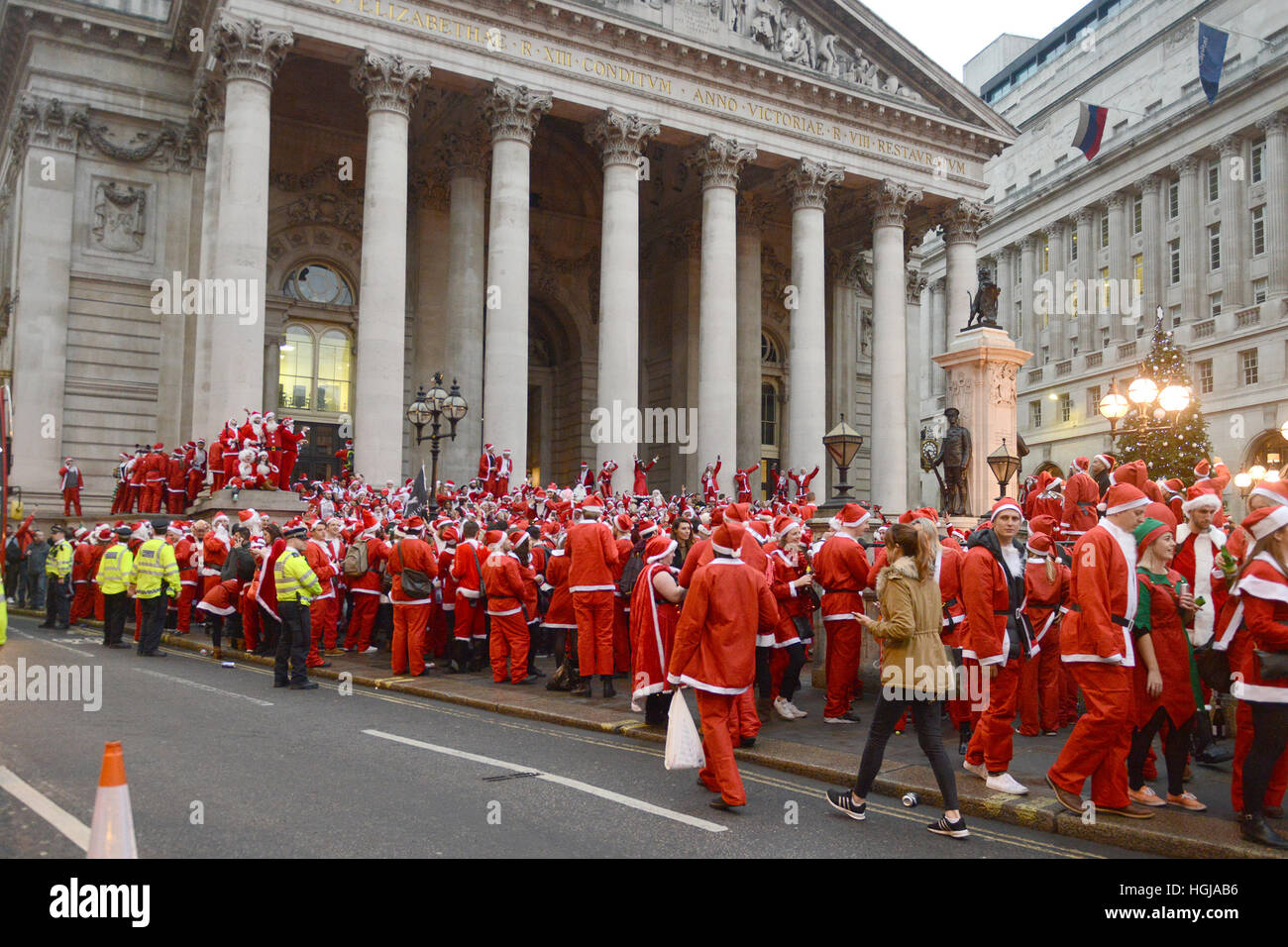Hundreds of people dressed as Santa take to the streets of London for ...