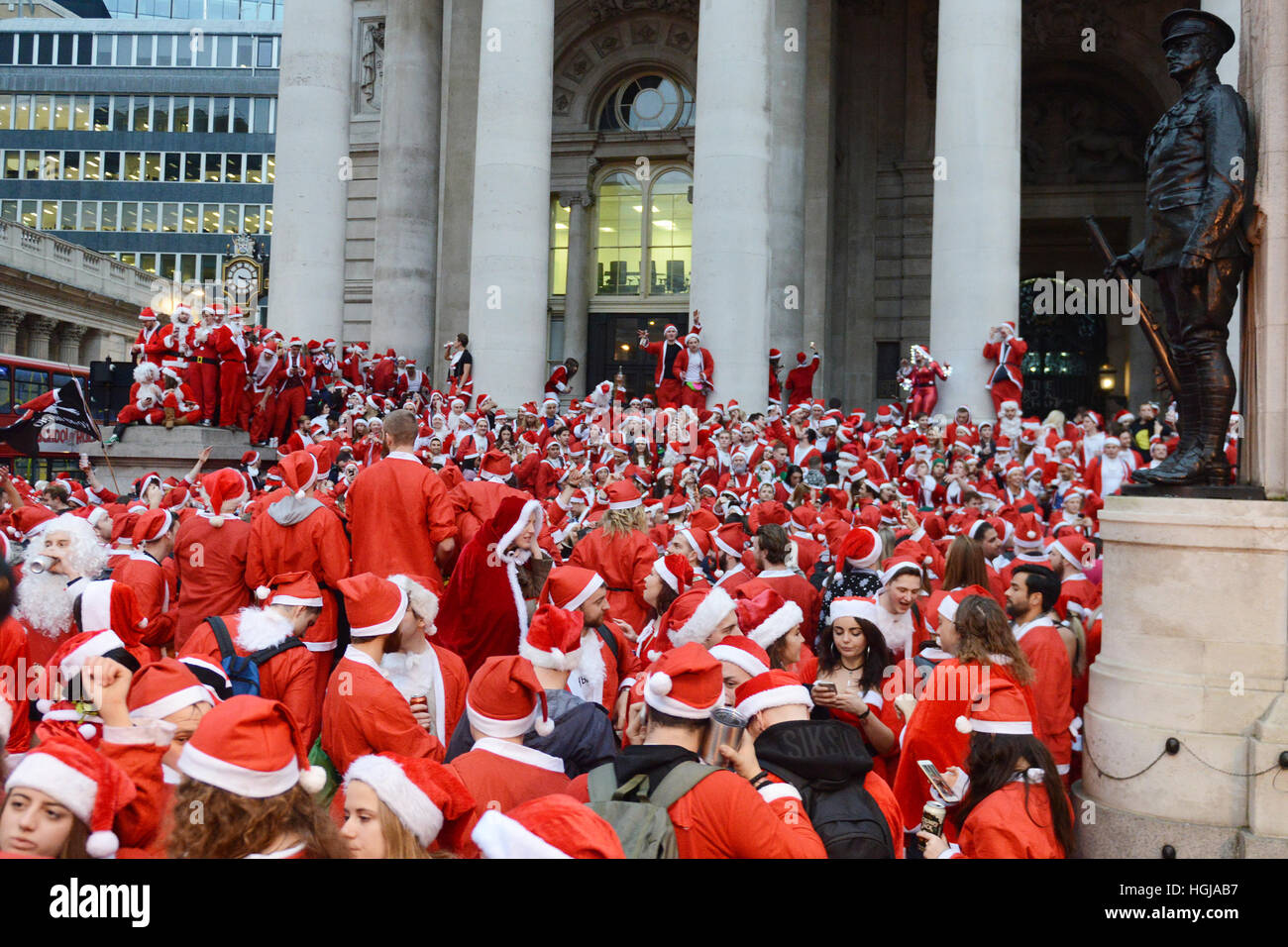 Hundreds of people dressed as Santa take to the streets of London for ...