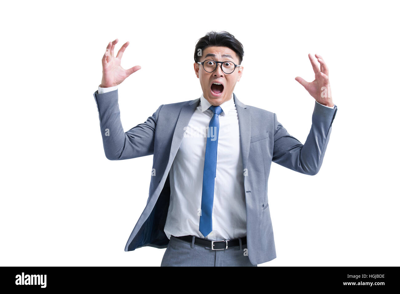 Shocked young businessman Stock Photo - Alamy