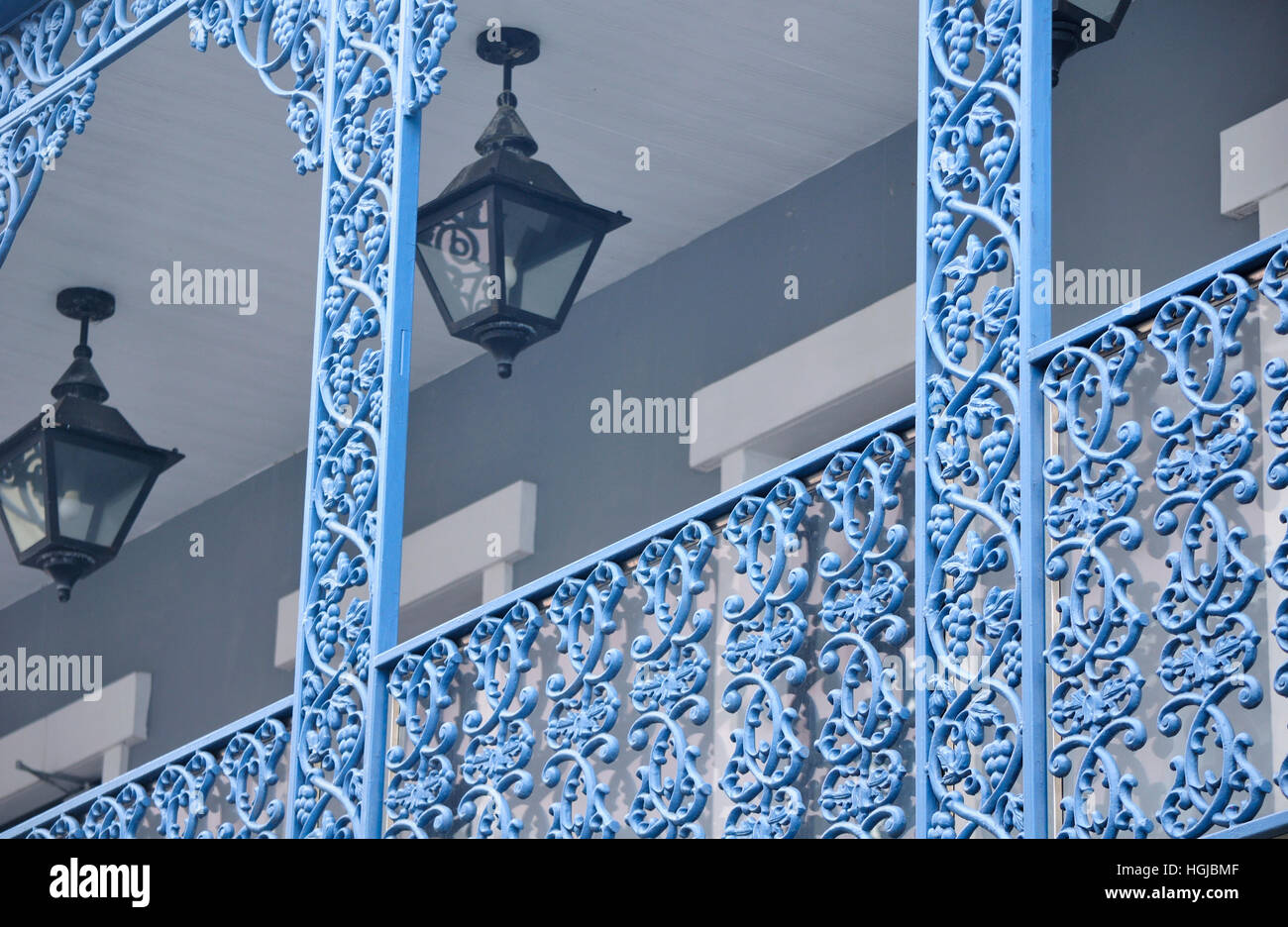 An intricately designed blue painted metal railing on a balcony of a ...