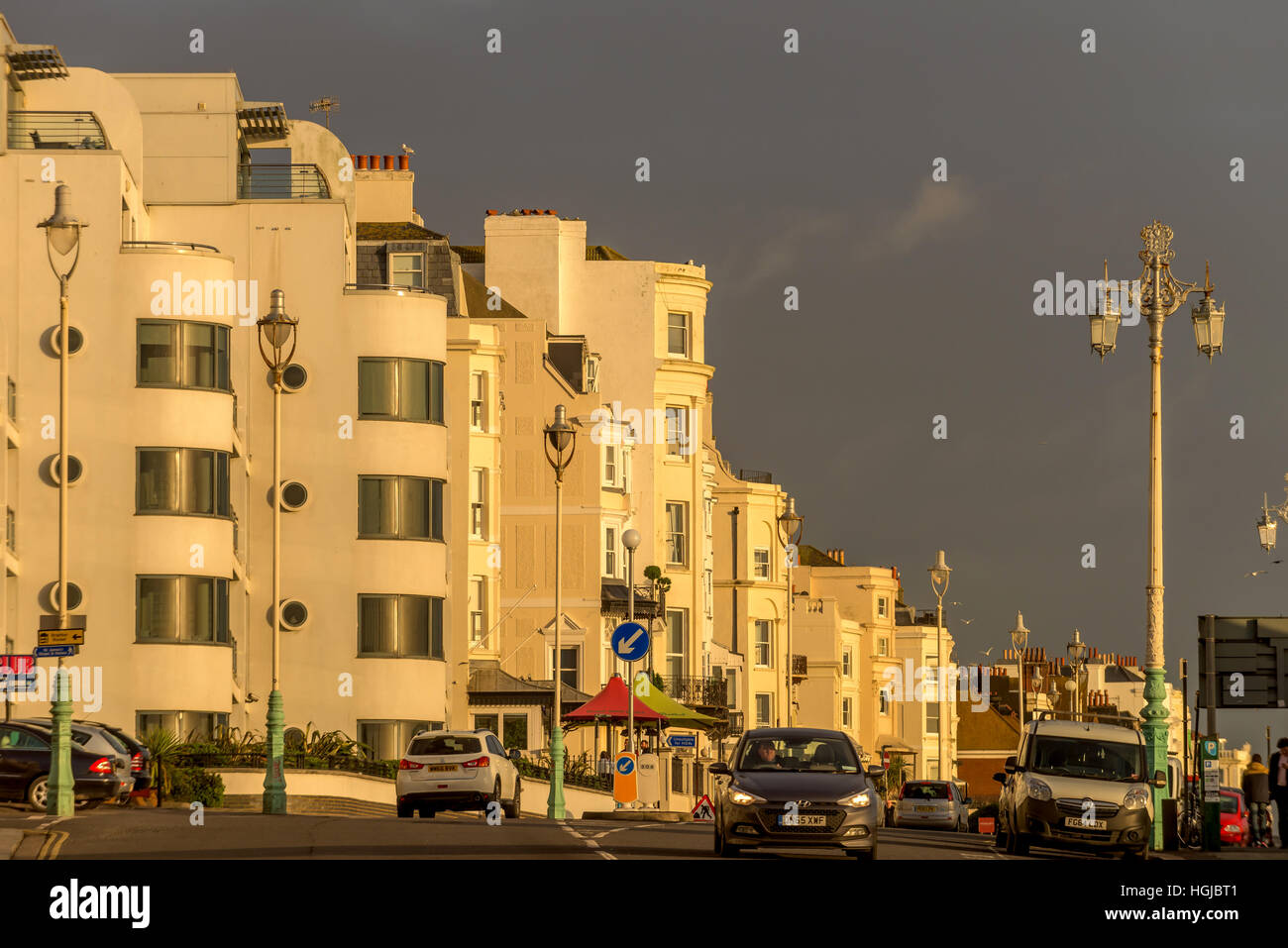 Golden light on the seafront at Brighton making the Regency buildings ...